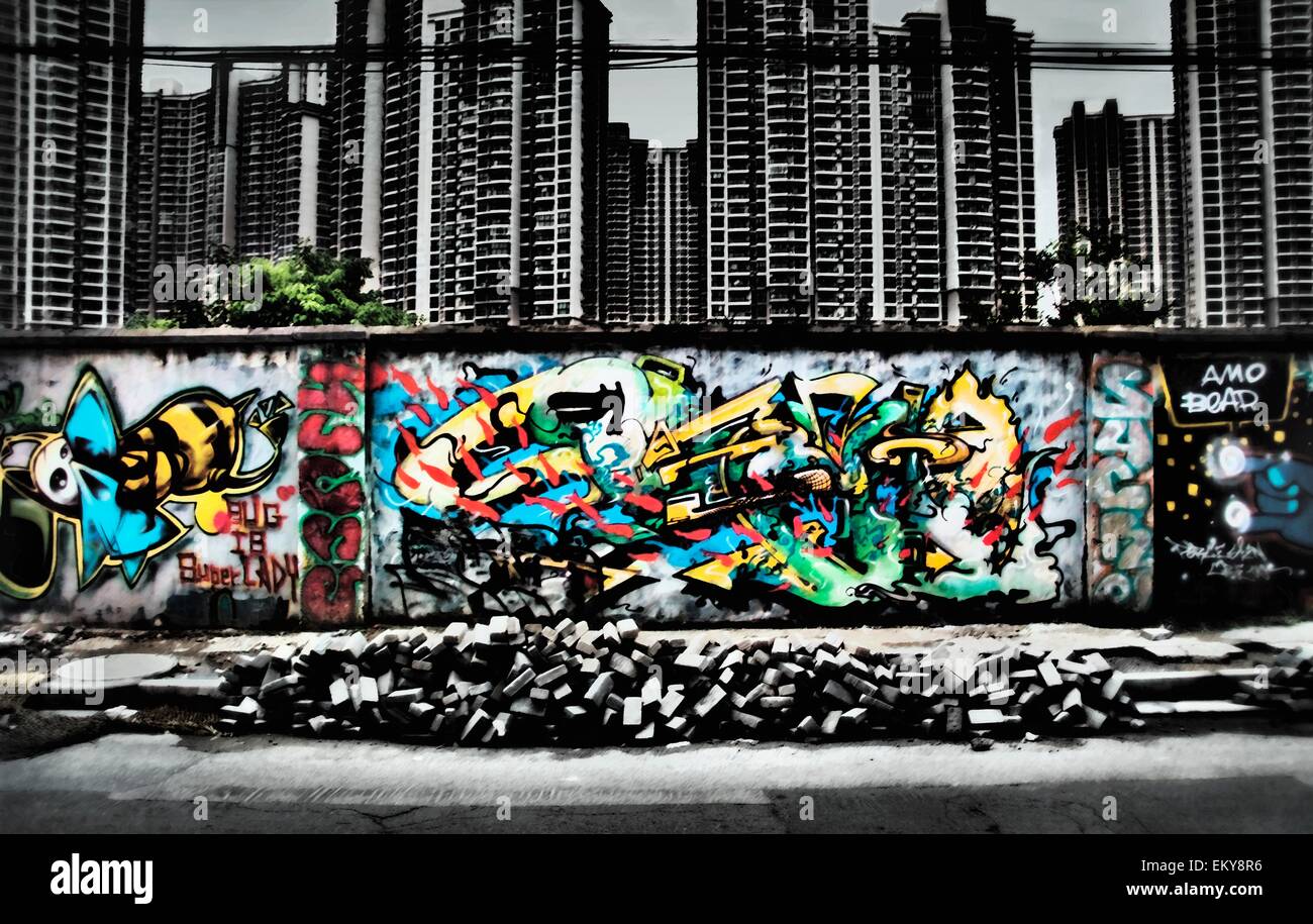A Wall Of Graffiti Below Highrises Stock Photo - Alamy
