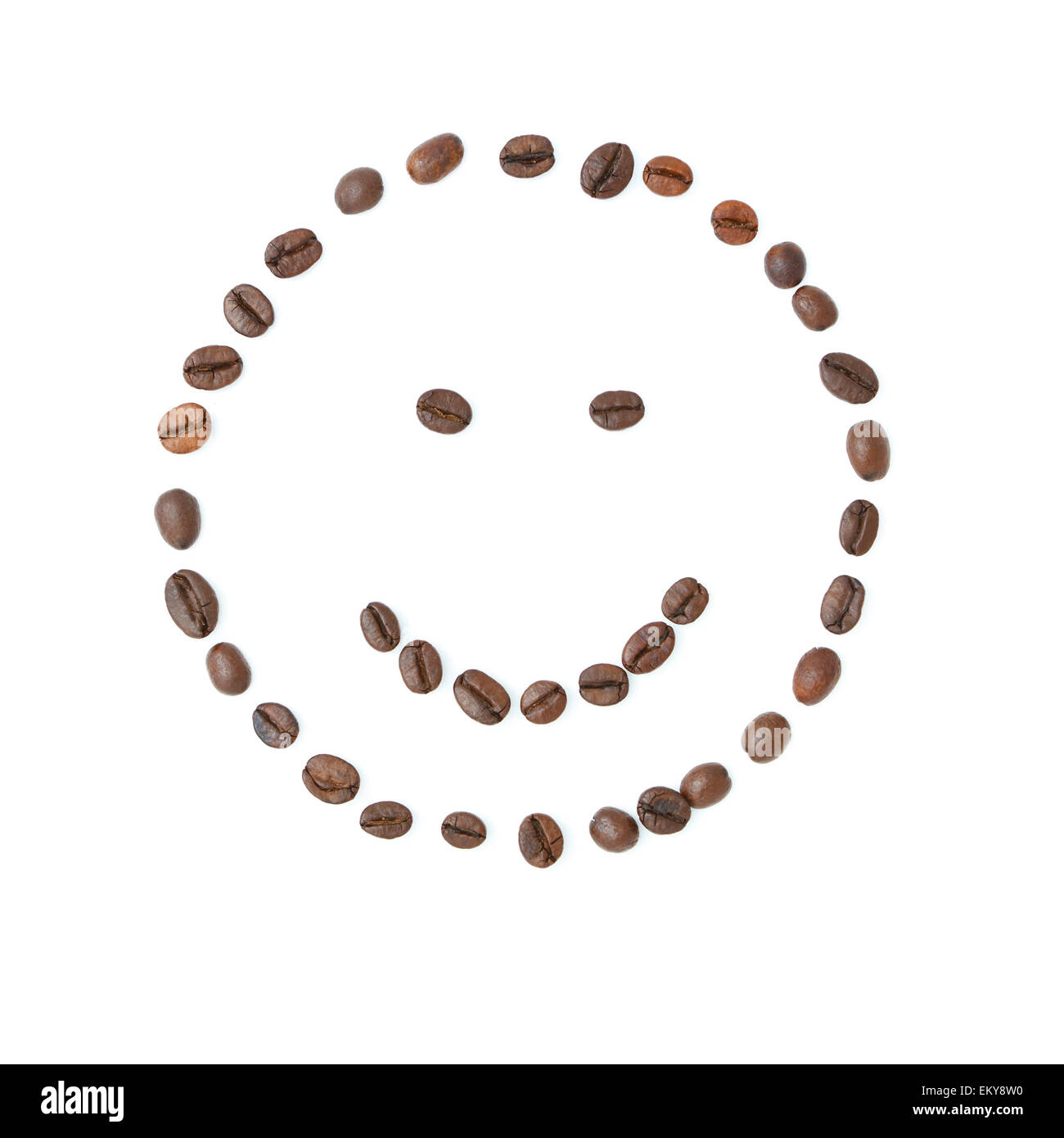 Emoticon smile made of coffee beans isolated on white background studio ...