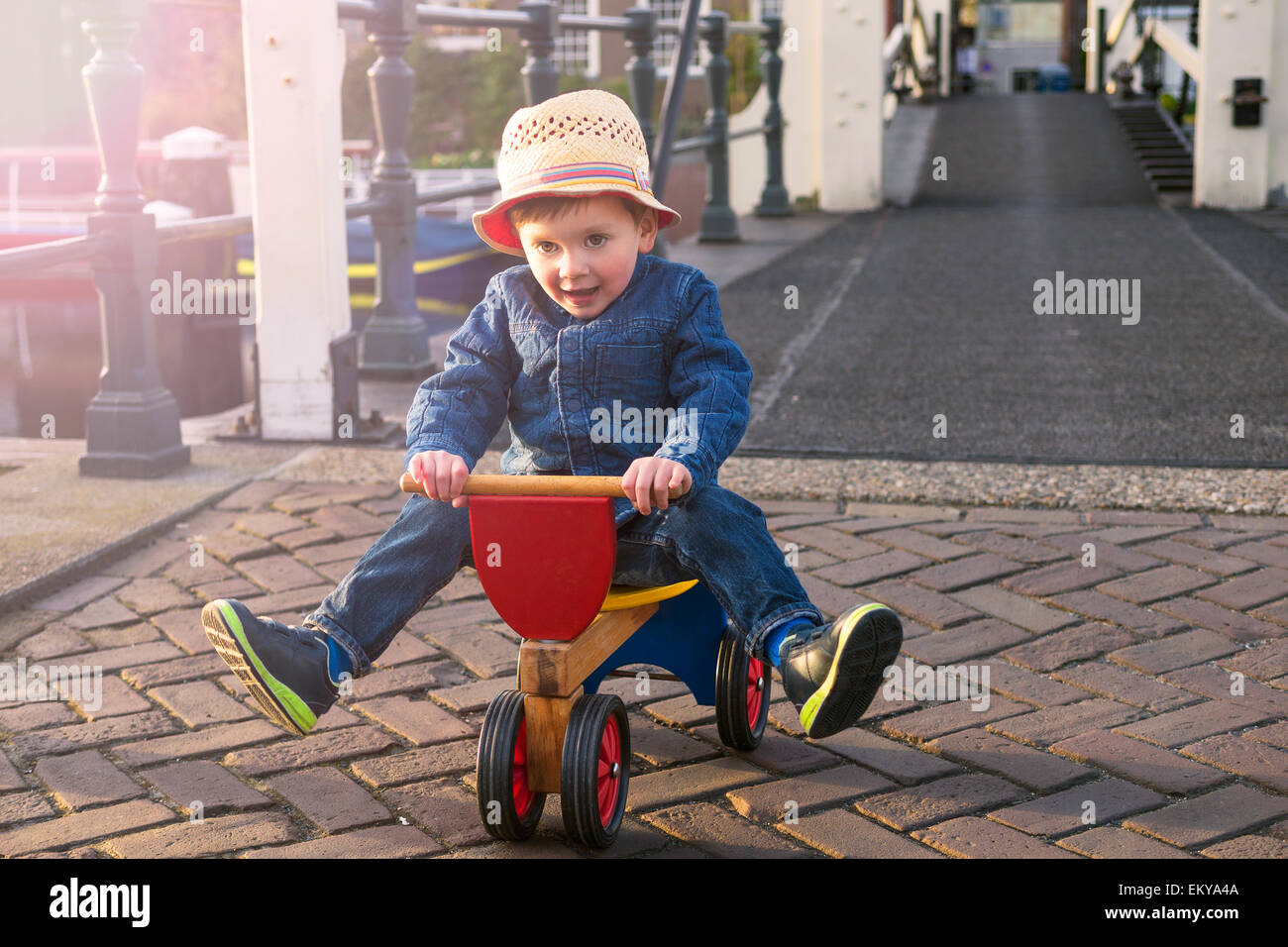 Happy child with tricycle hi-res stock photography and images - Alamy