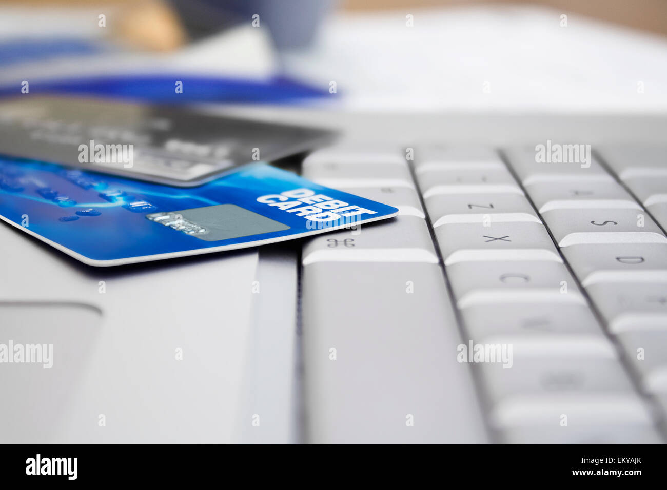 A Group off credit cards and bank cards on a laptop keyboard Stock ...
