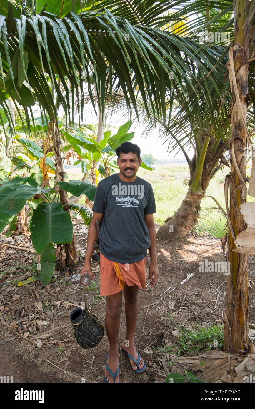 An Indian man demonstrates how to make Palm Wine (toddy) as part of a ...
