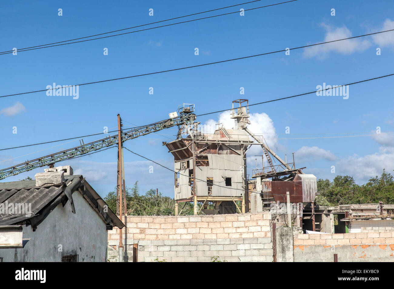 Part of an old factory in Cuba with telegraph wires Stock Photo - Alamy