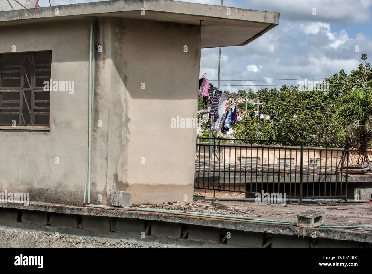 Roof of a house with washing drying on a clothes line. View from the ...