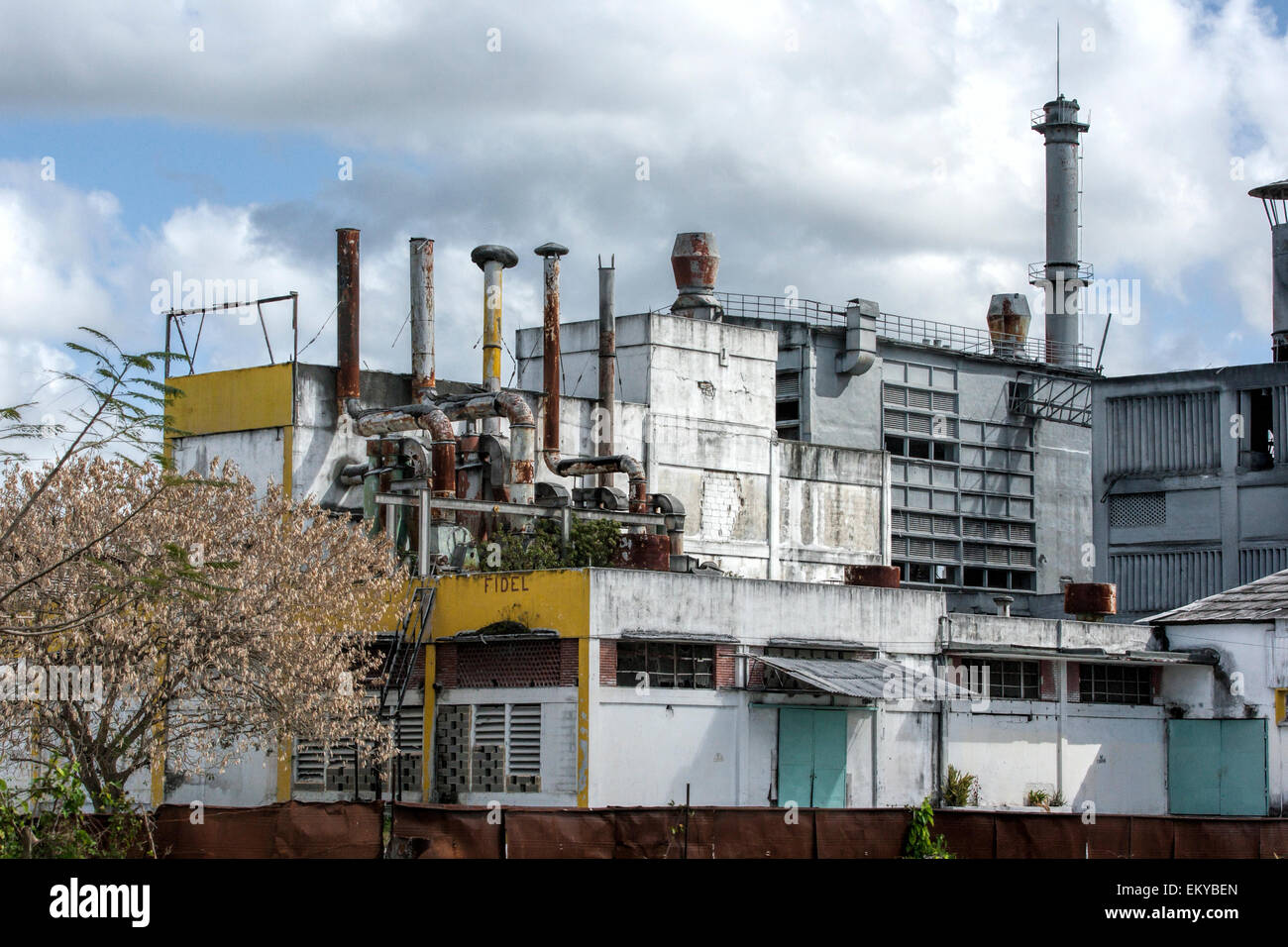 Factory in a remote part of Cuba. Image taken from a train passing on a ...