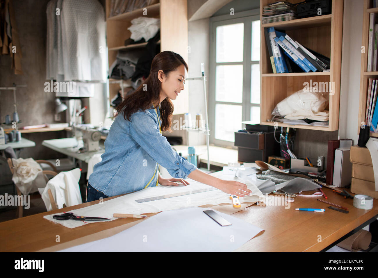 Fashion designer working in studio Stock Photo - Alamy