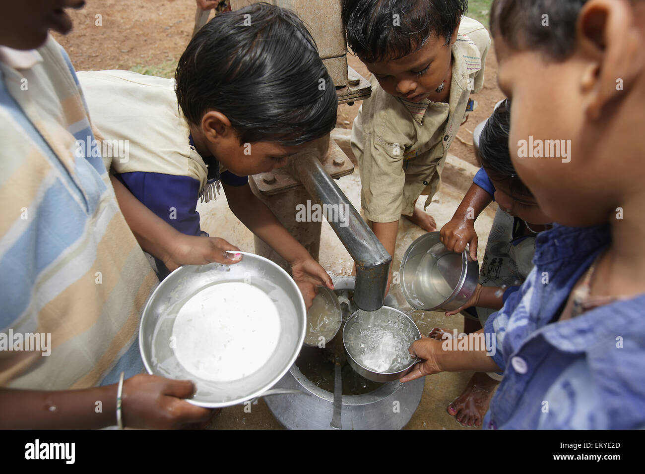 Children washing dishes after a meal; India Stock Photo - Alamy