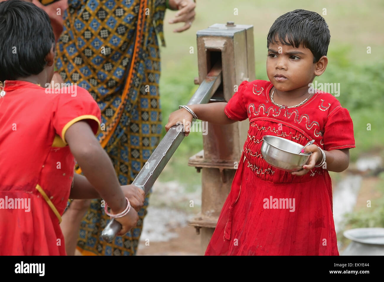 Young students washing their bowls after lunch; Badabhuin Village ...