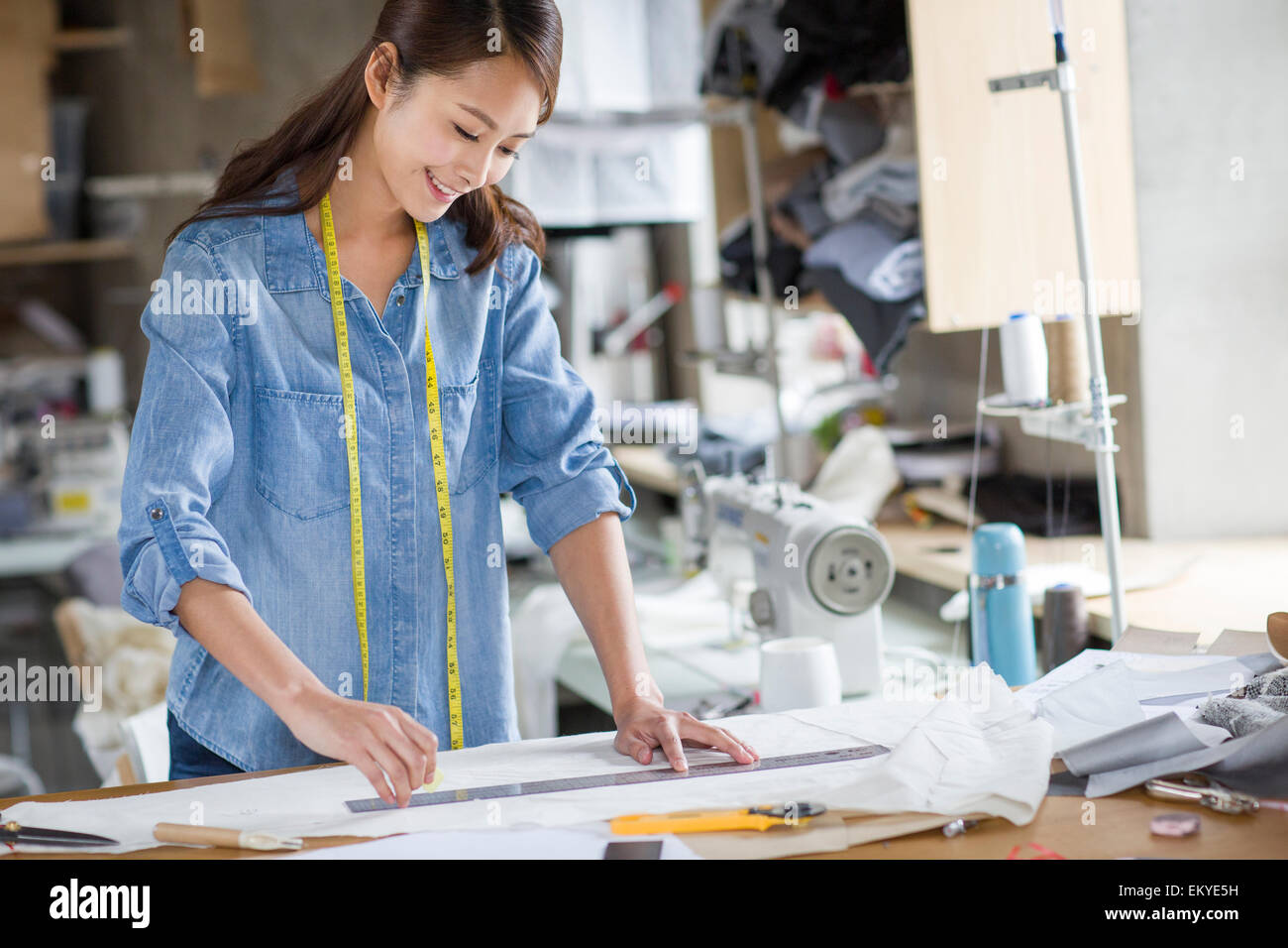 Fashion designer working in studio Stock Photo - Alamy