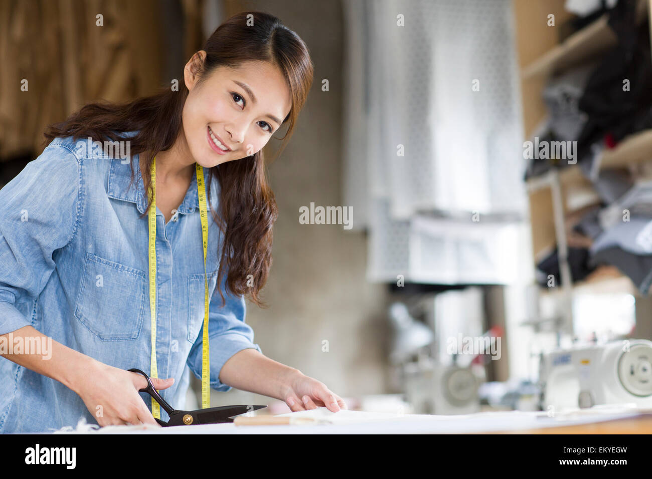 Fashion designer working in studio Stock Photo - Alamy