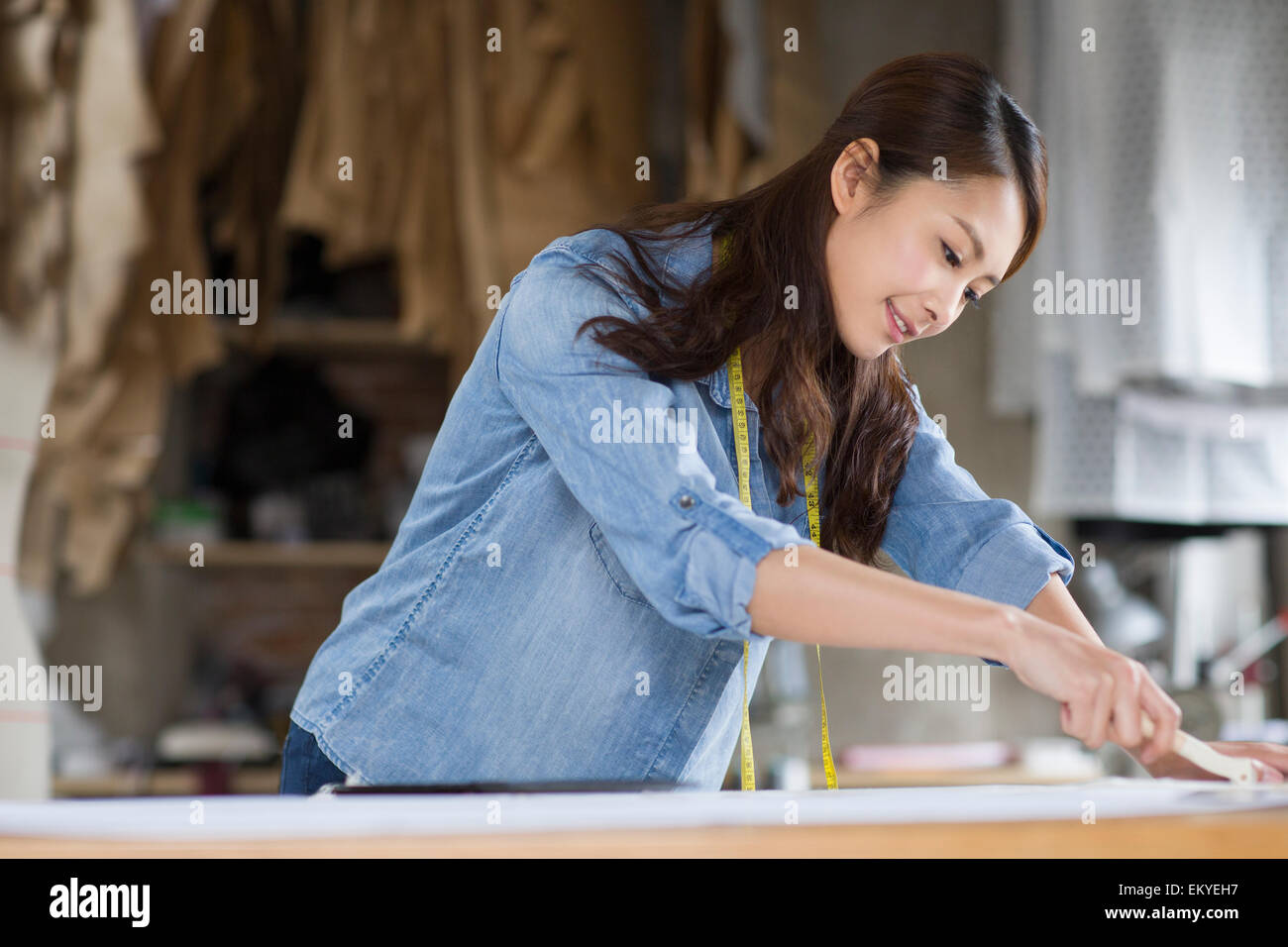 Fashion designer working in studio Stock Photo - Alamy