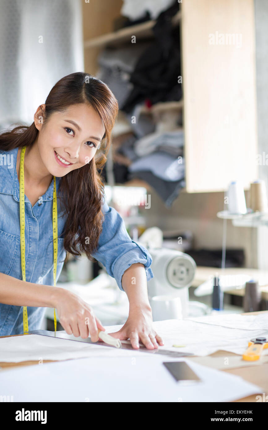 Fashion designer working in studio Stock Photo - Alamy