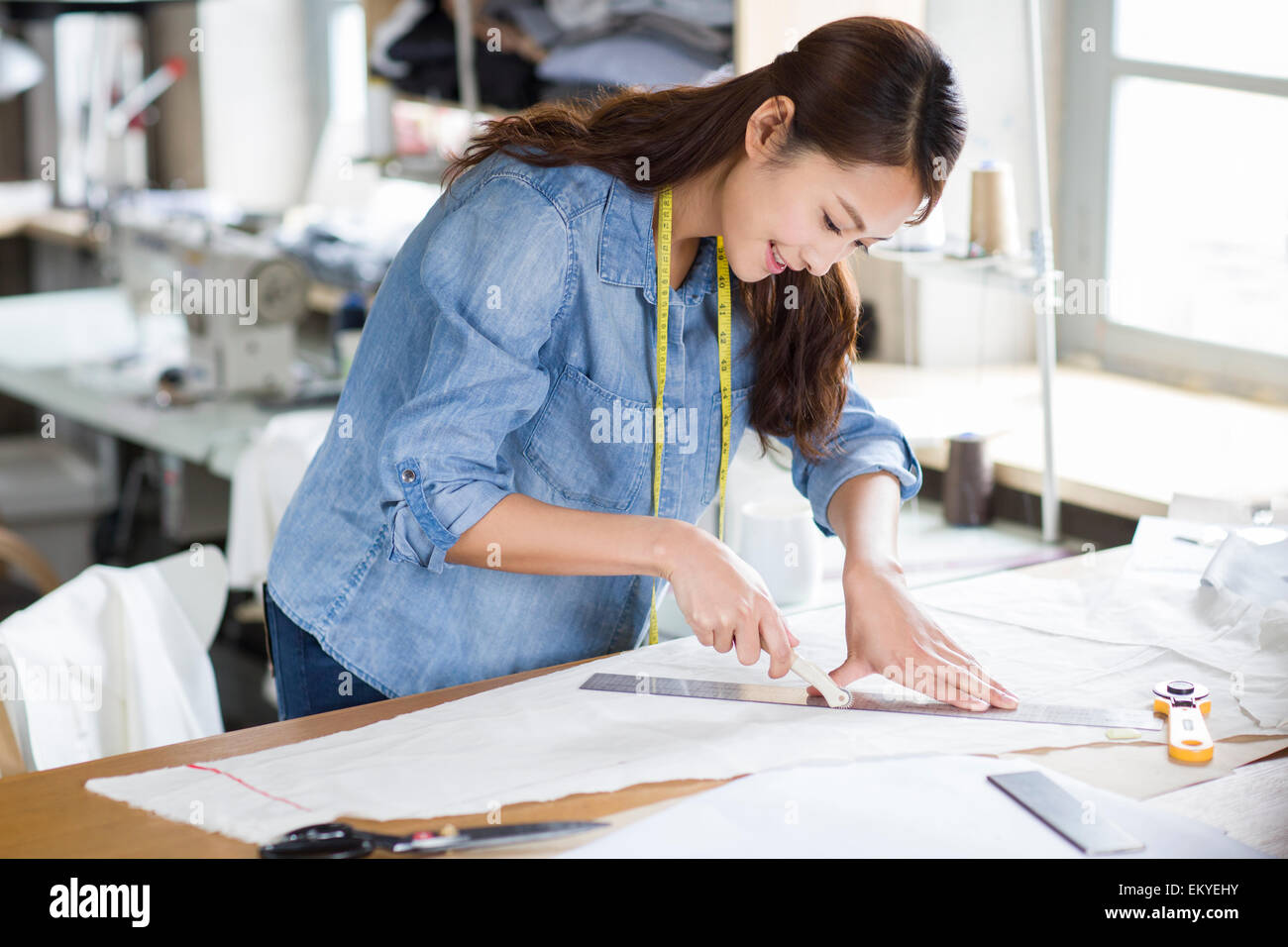 Fashion designer working in studio Stock Photo - Alamy