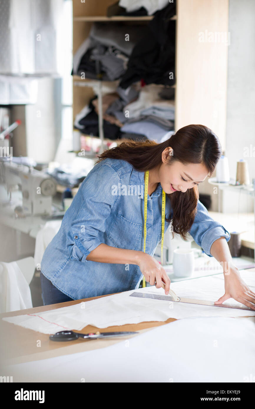 Fashion designer working in studio Stock Photo - Alamy
