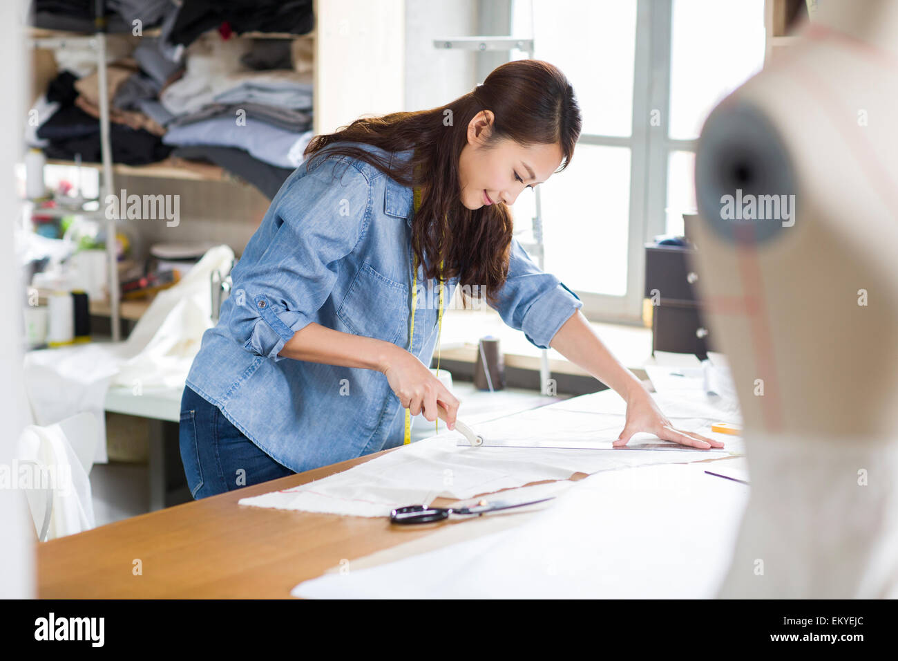 Fashion designer working in studio Stock Photo - Alamy