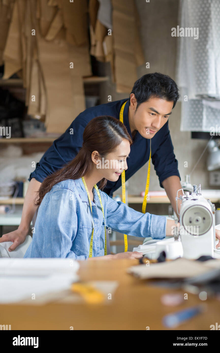 Two fashion designers working in studio Stock Photo - Alamy