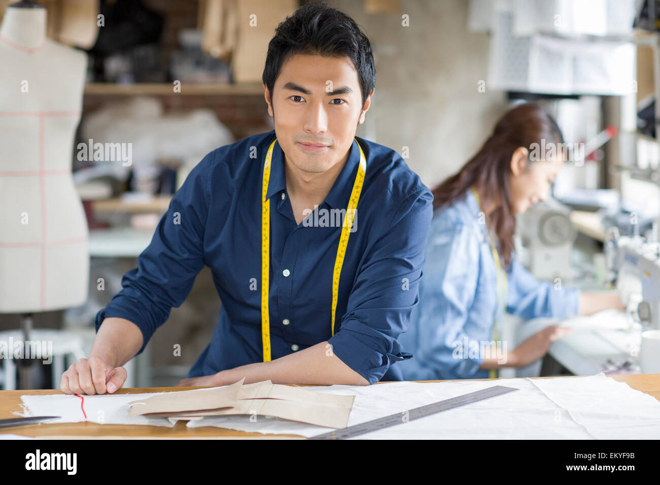 Two fashion designers working in studio Stock Photo - Alamy