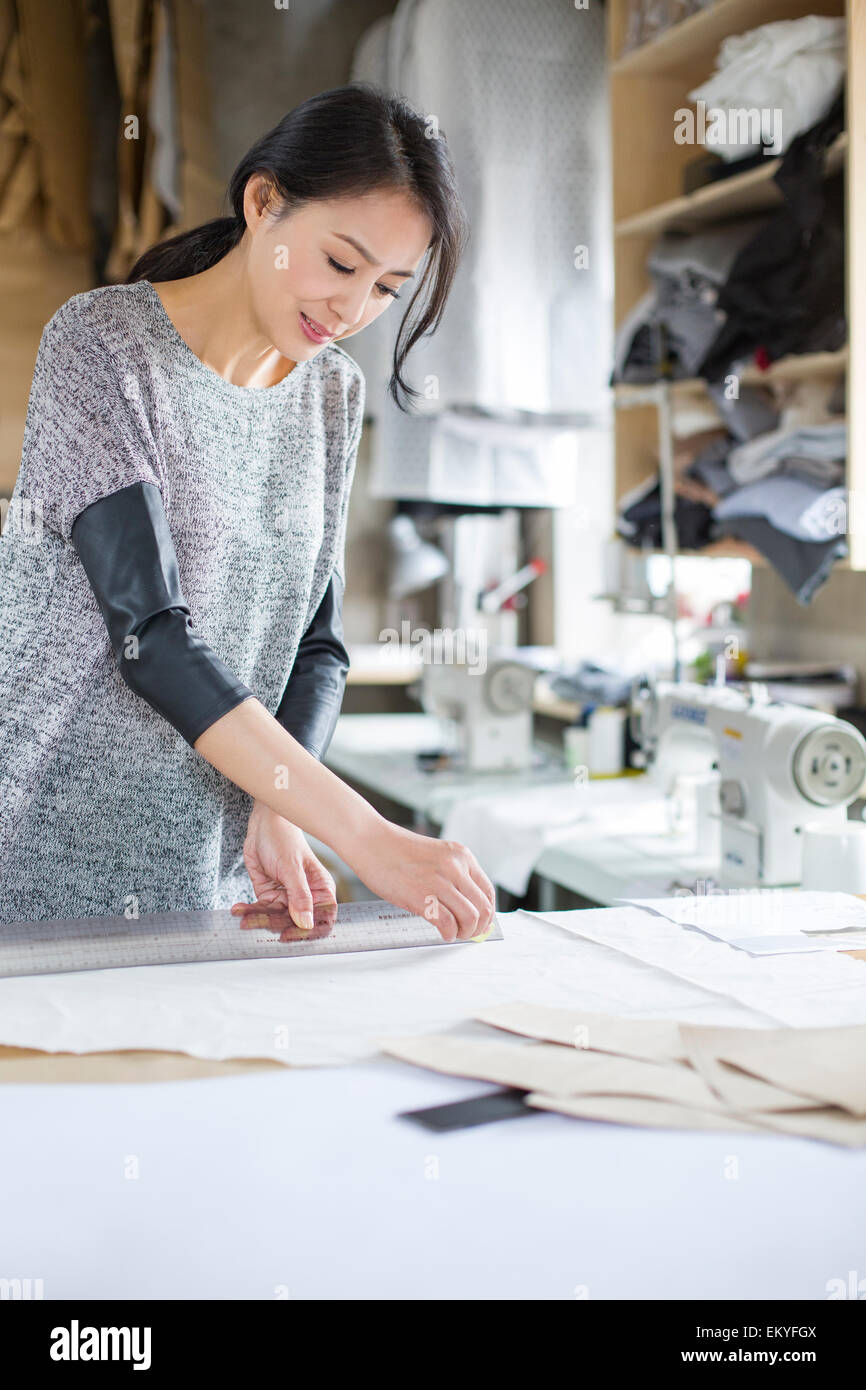 Fashion designer working in studio Stock Photo - Alamy