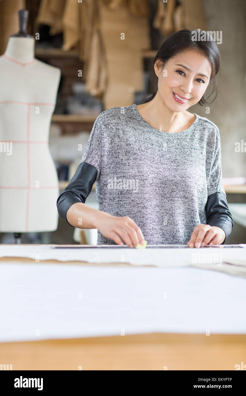 Fashion designer working in studio Stock Photo - Alamy