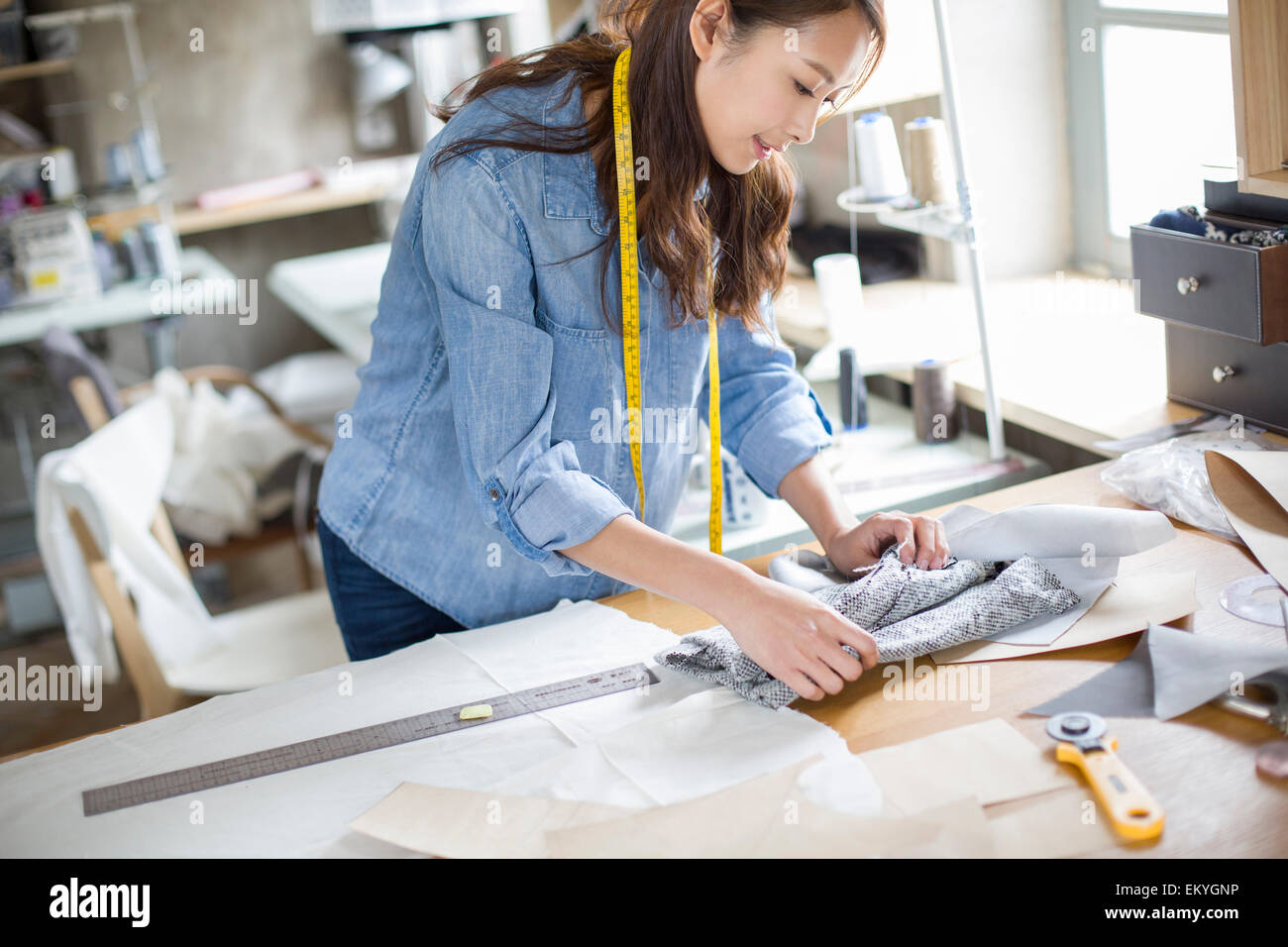 Fashion designer working in studio Stock Photo - Alamy