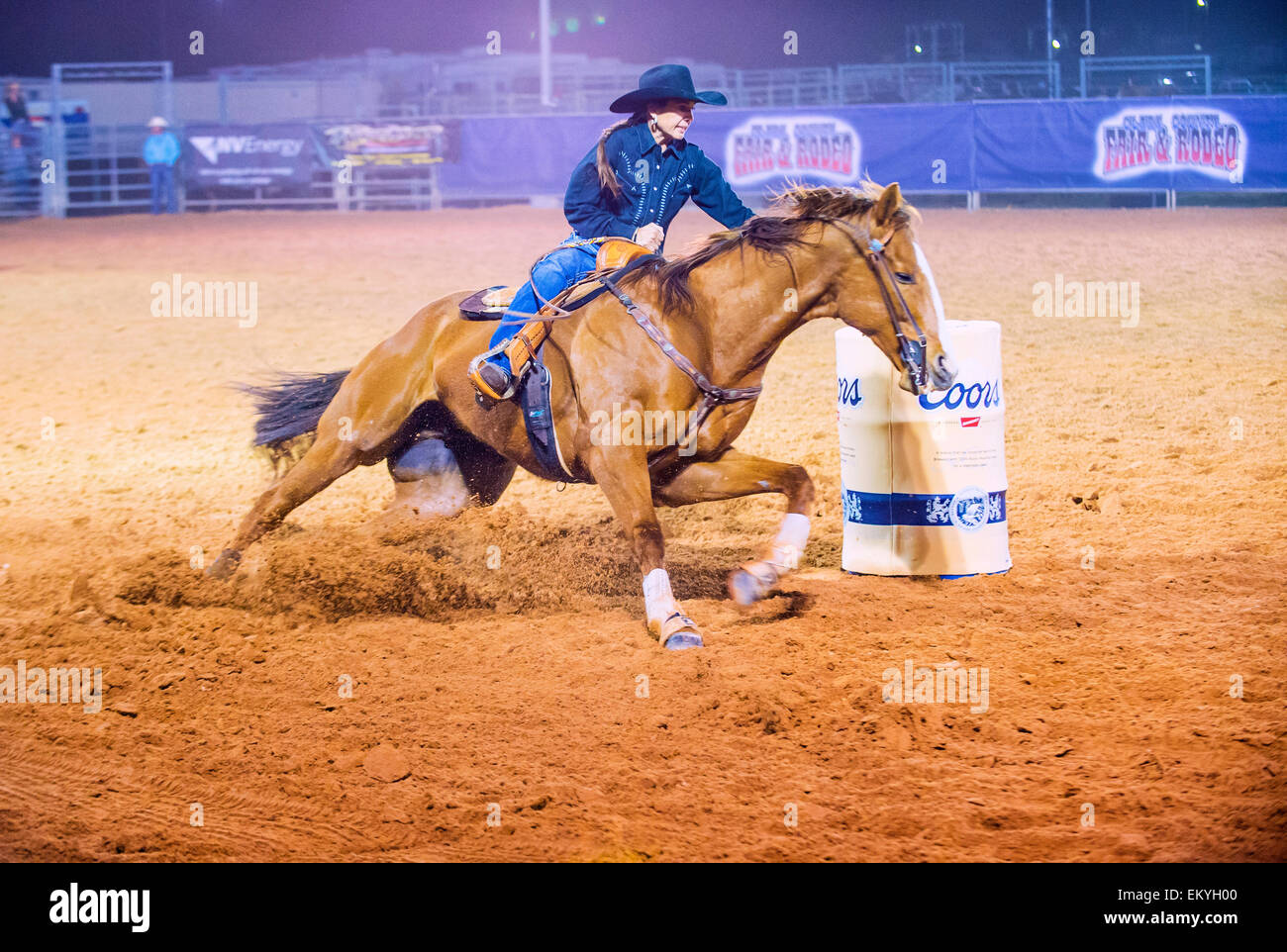 Cowgirl Participating in a Barrel racing competition in the Clark ...