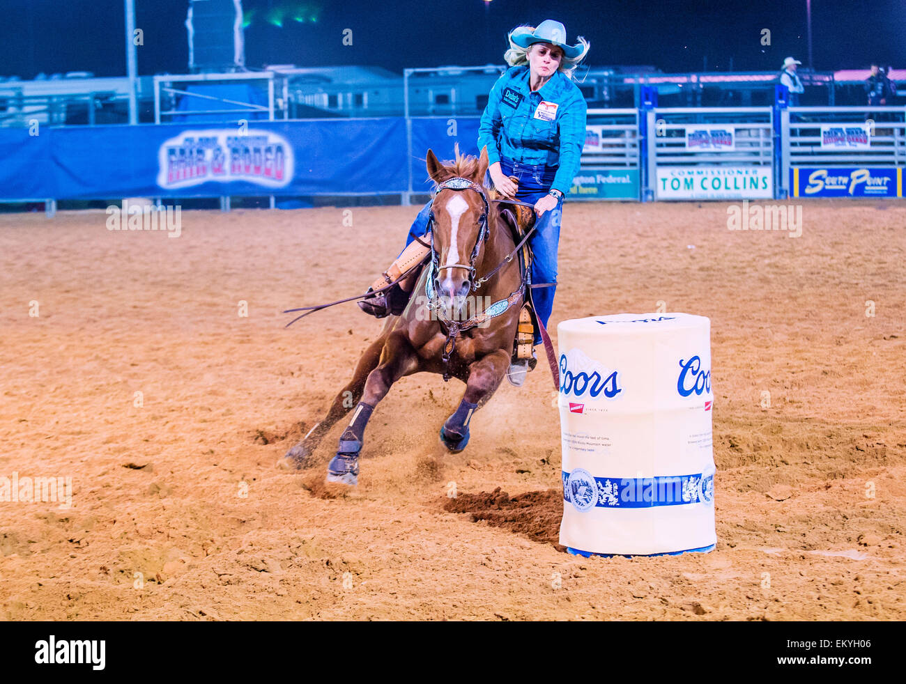 Cowgirl Participating in a Barrel racing competition in the Clark ...