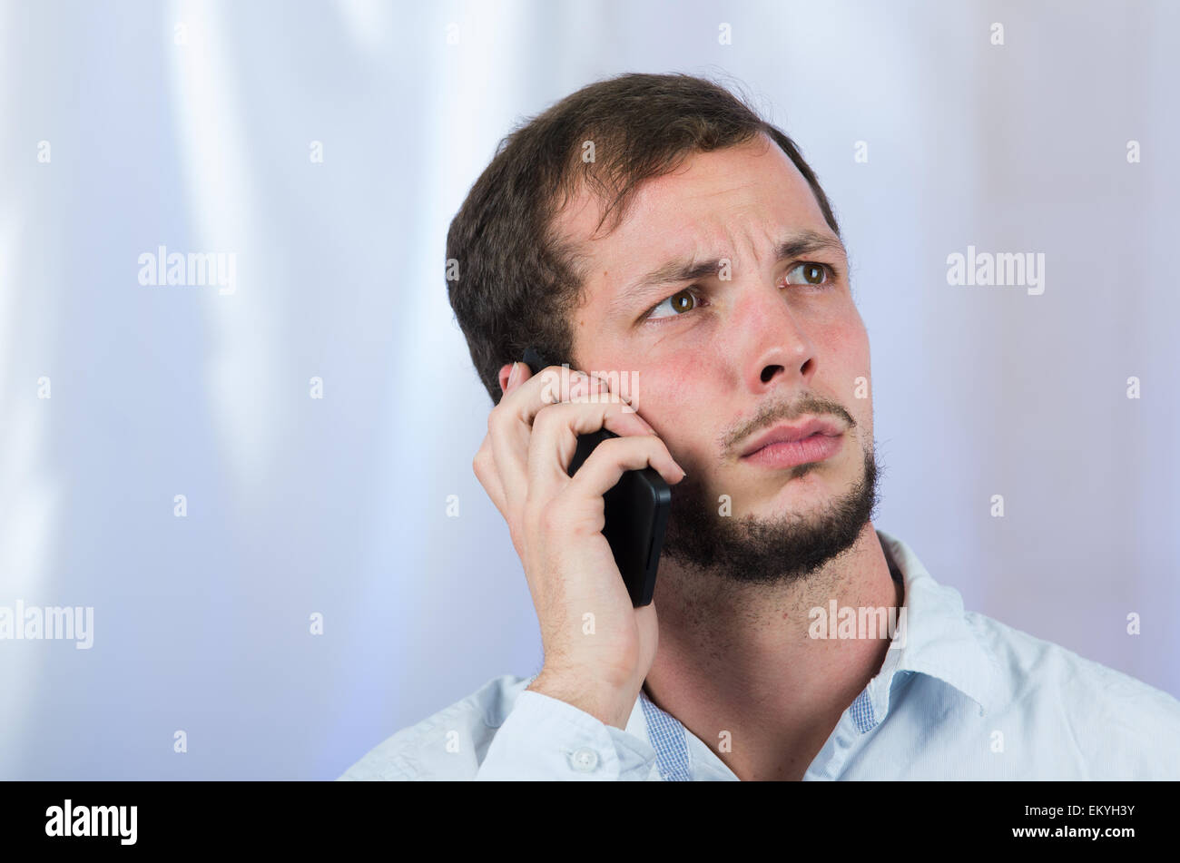 young handsome man using cell phone Stock Photo - Alamy