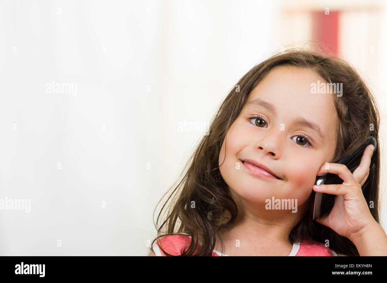 cute little girl using cell phone Stock Photo - Alamy