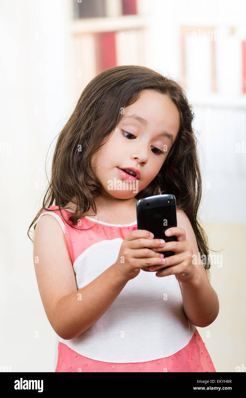 cute little girl using cell phone Stock Photo - Alamy