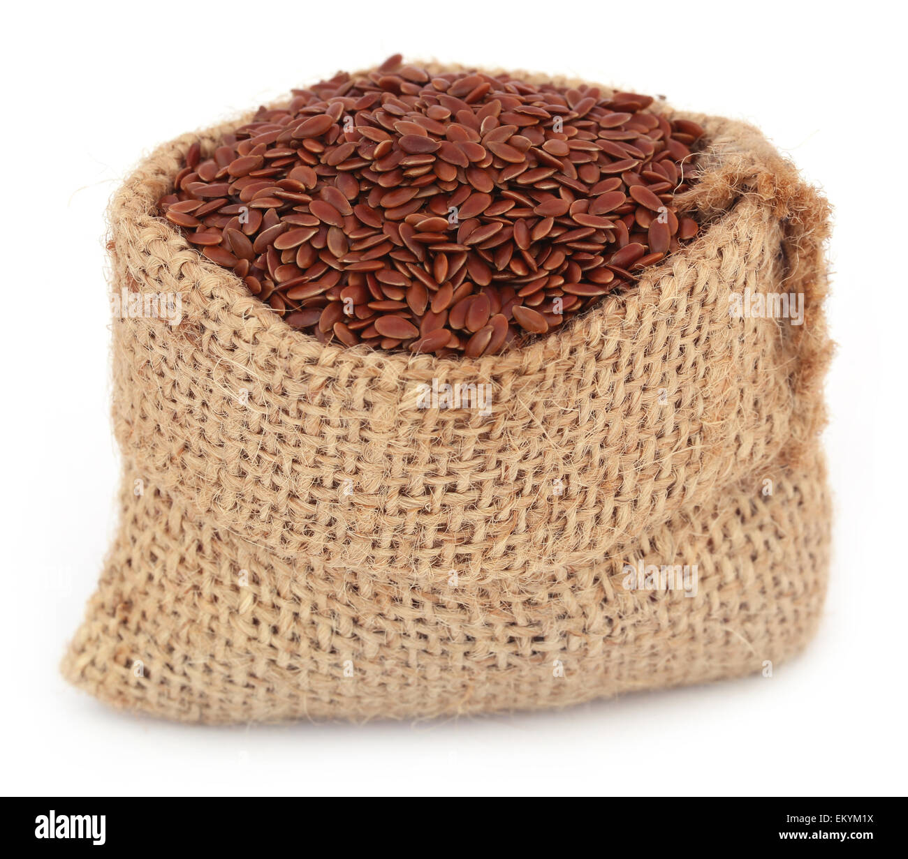 Flax seeds in jute bag over white background Stock Photo - Alamy