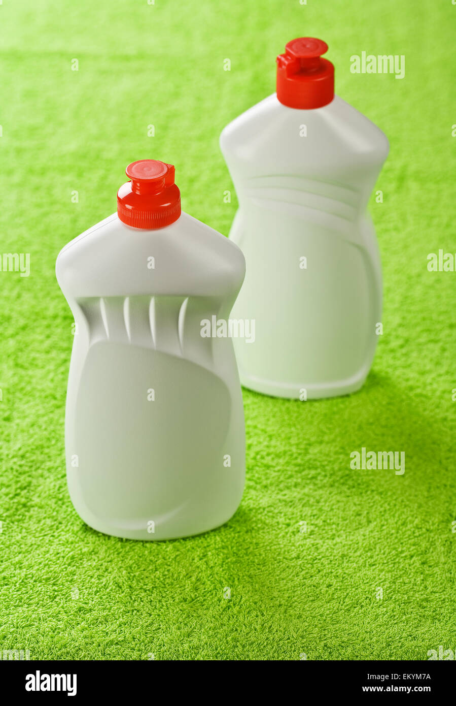 two plastic bottles on green towel Stock Photo - Alamy