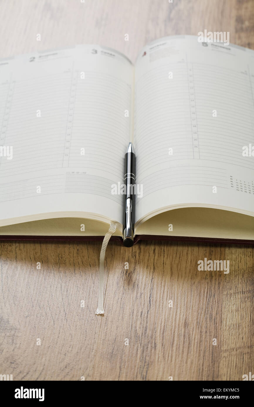 open notebook with pen Stock Photo - Alamy