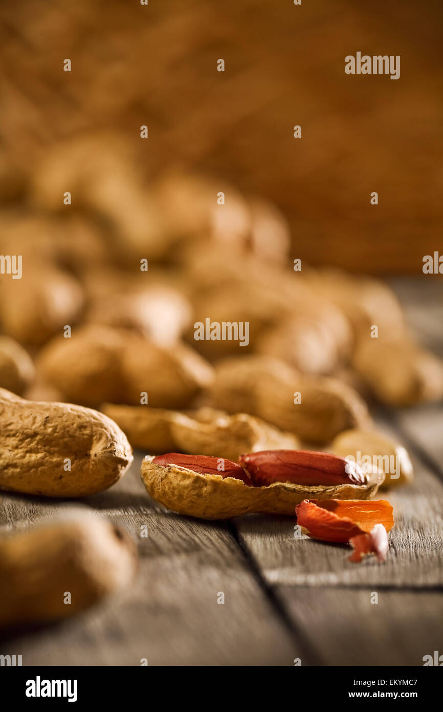peanuts on the wooden table Stock Photo - Alamy