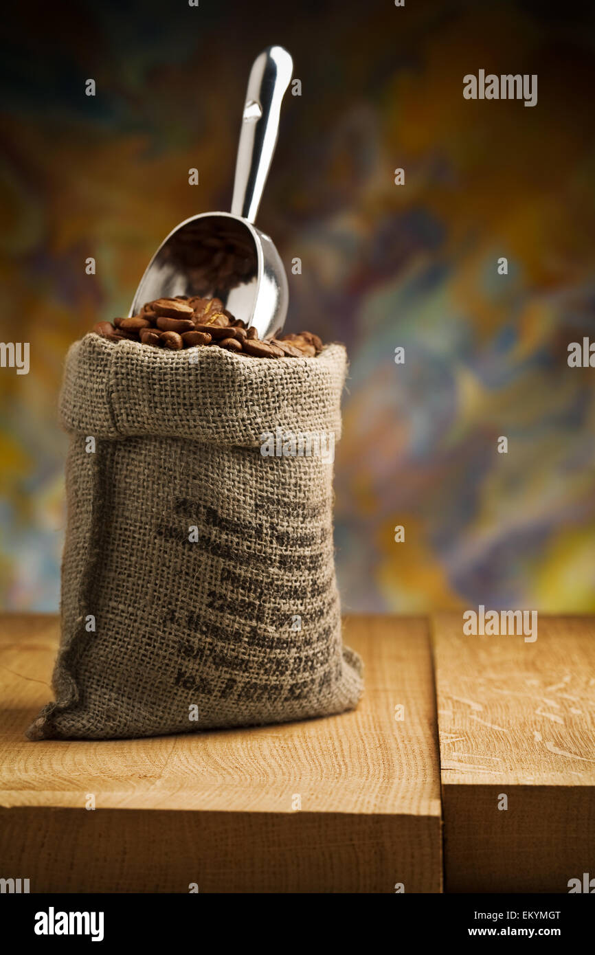 small sack fith coffee beans and scoop Stock Photo - Alamy