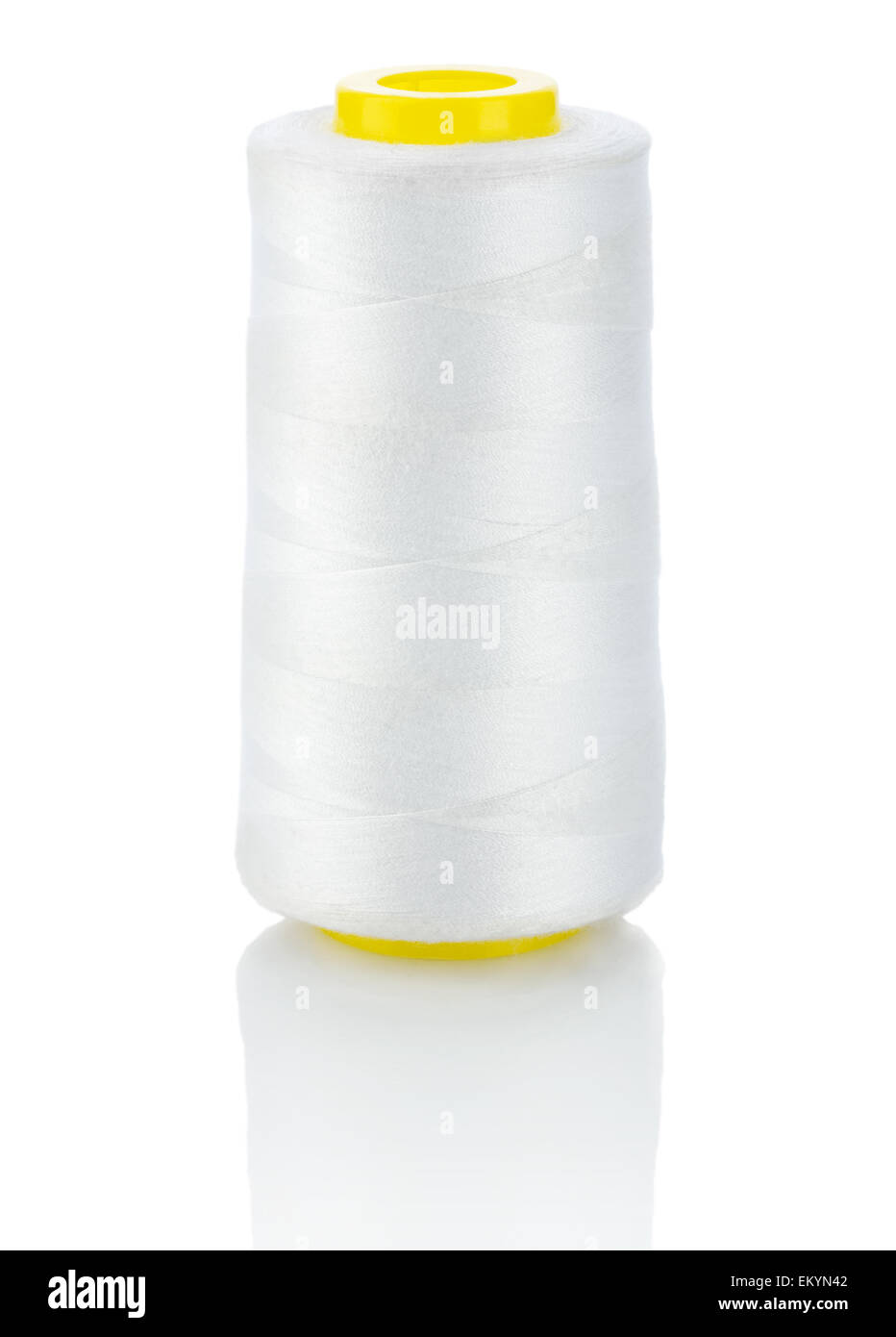 white thread on yellow spool Stock Photo - Alamy