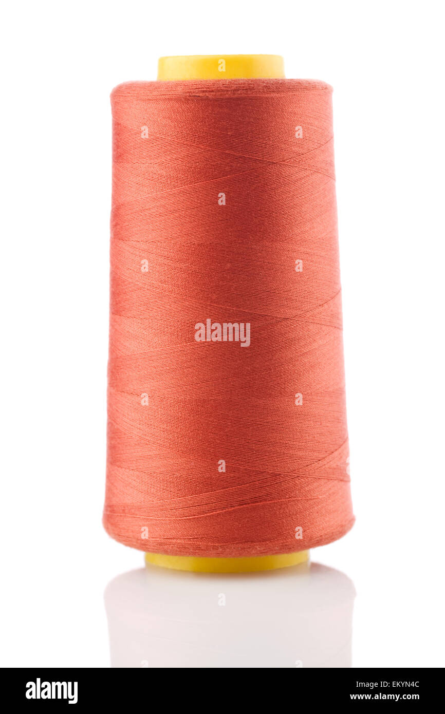 yellow bobin with red string Stock Photo - Alamy