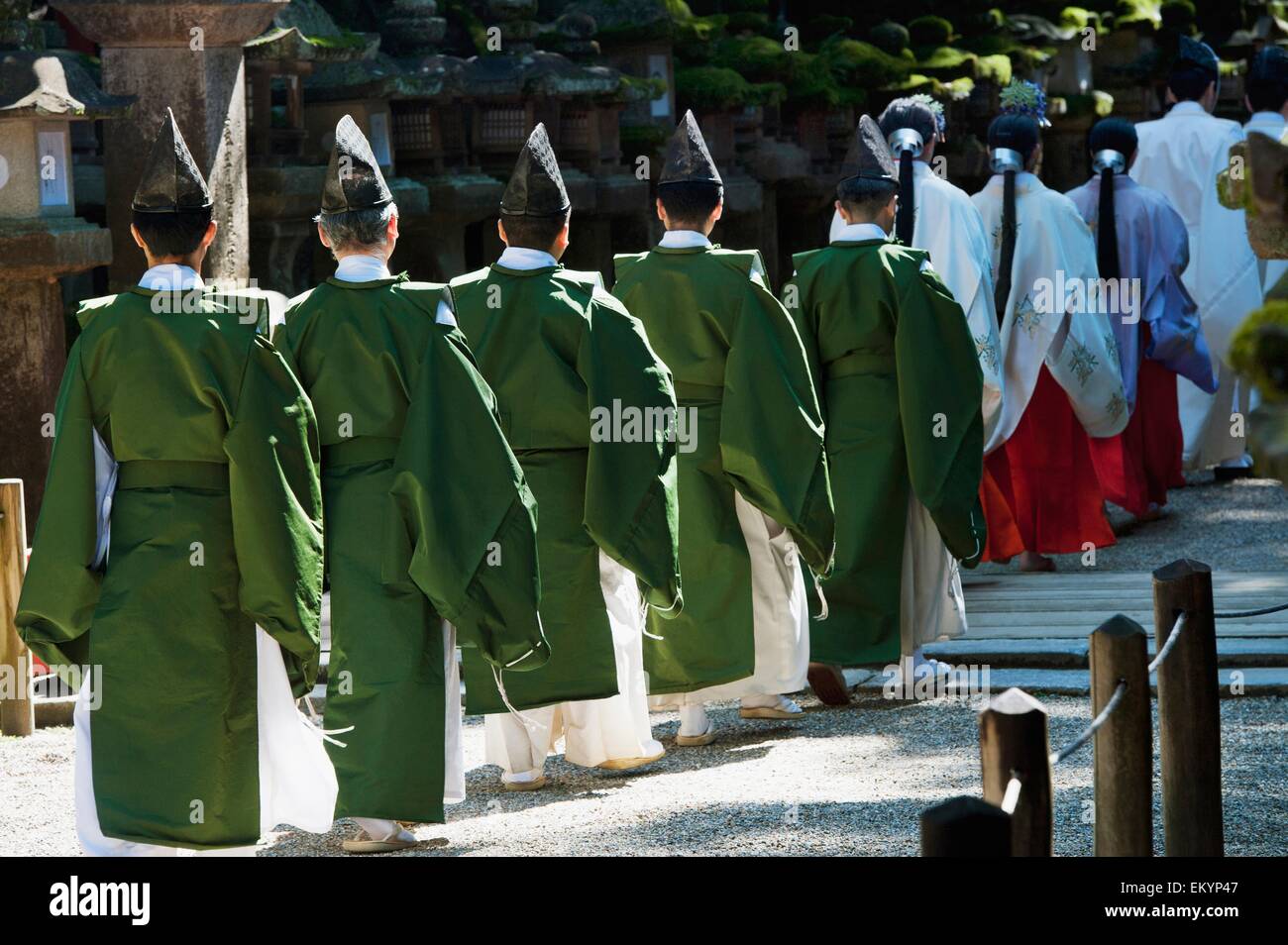 A Procession Of People Walking In Robes At The Kasuga Grand Shrine ...