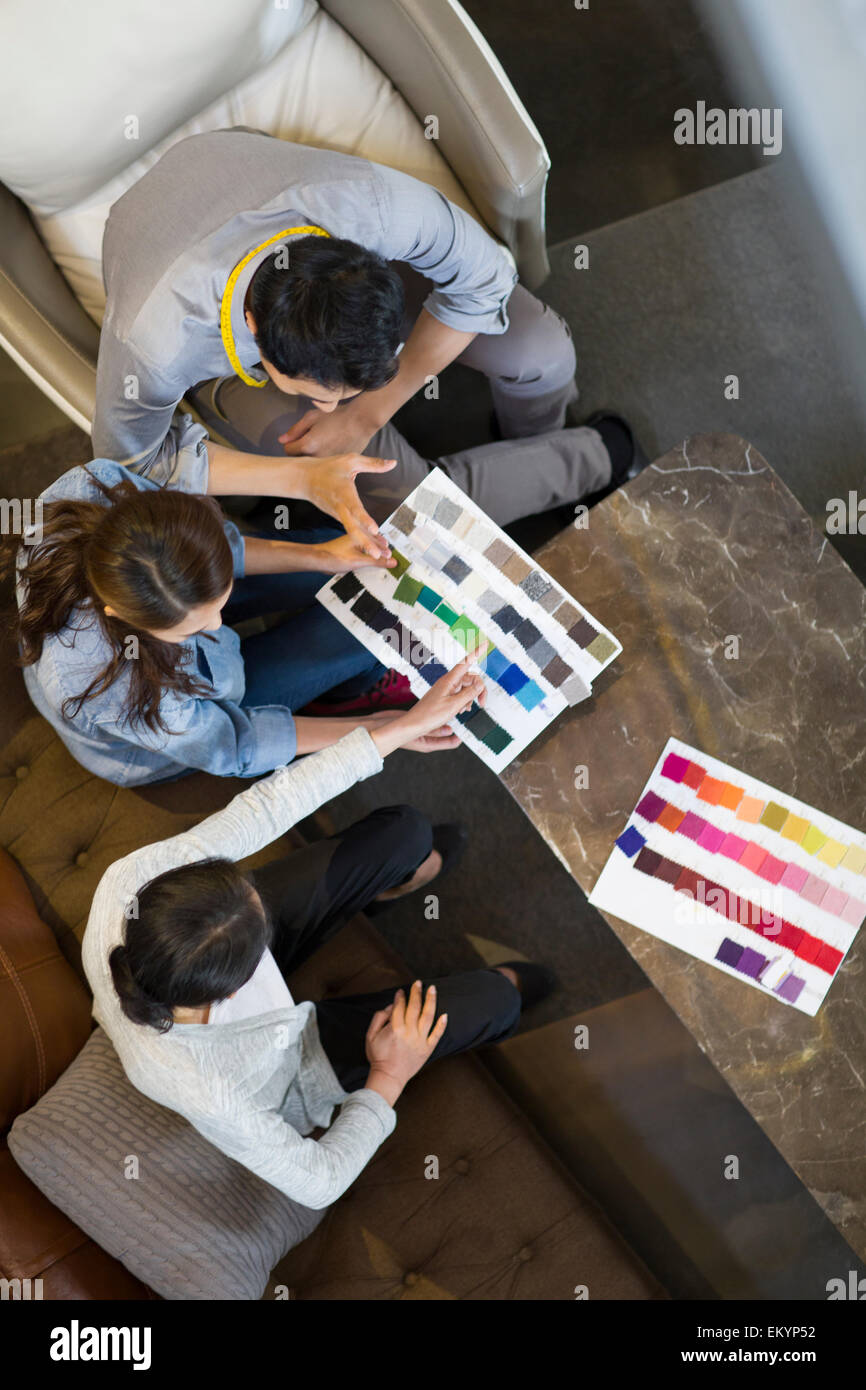 Fashion designers talking in studio Stock Photo - Alamy