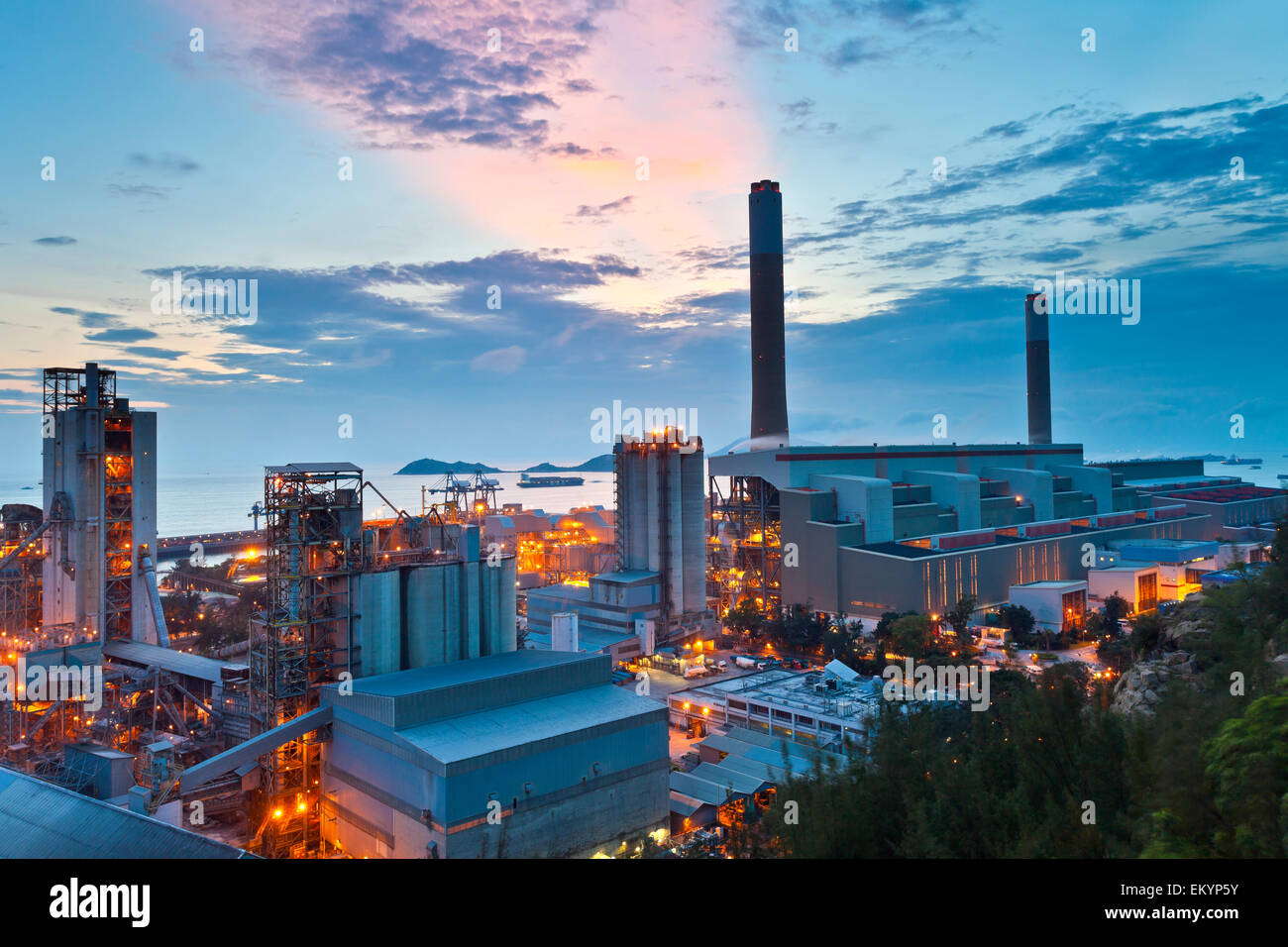 Power plant at sunset along coast Stock Photo - Alamy