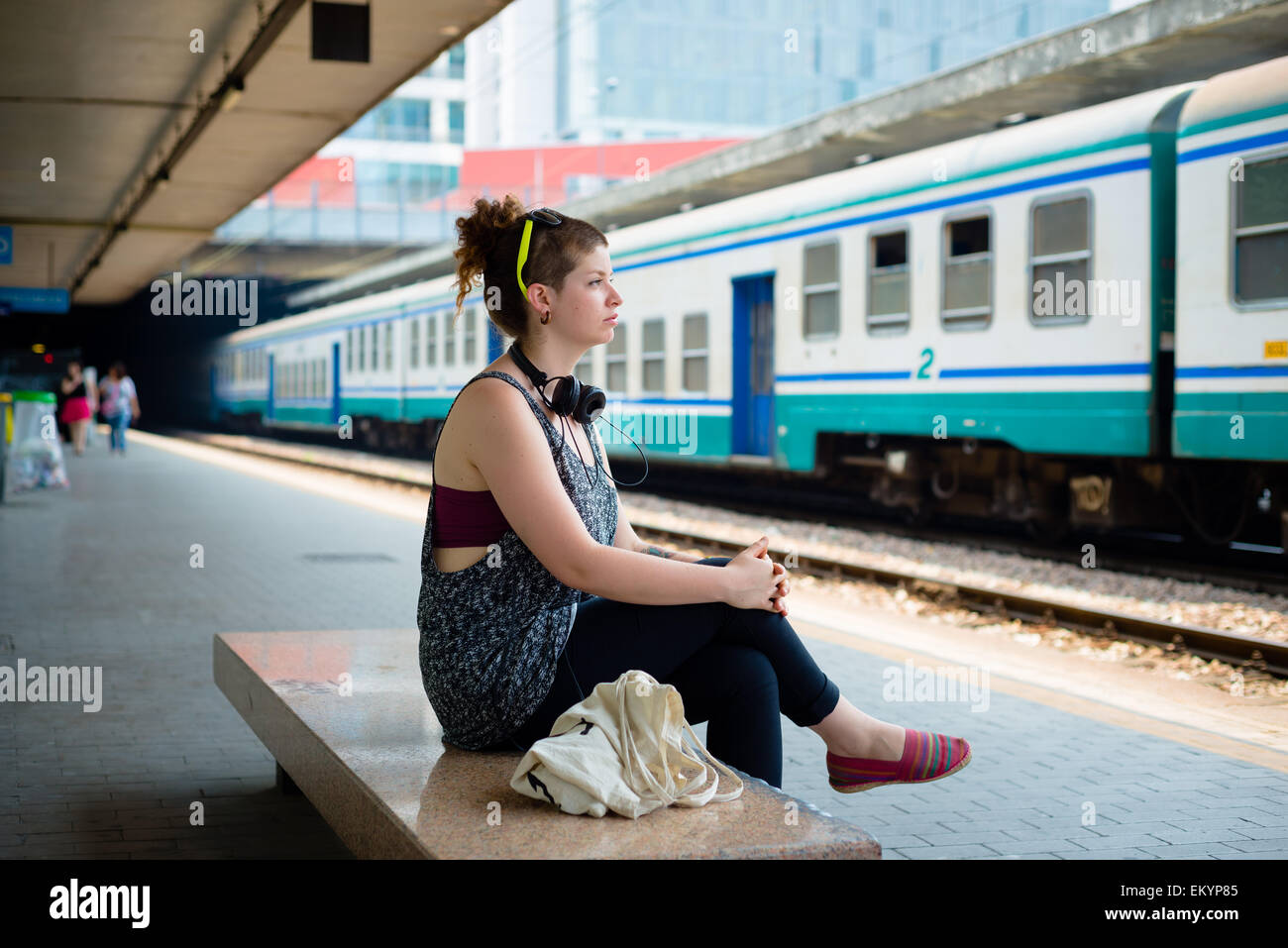 beautiful stylish modern young woman waiting train Stock Photo - Alamy