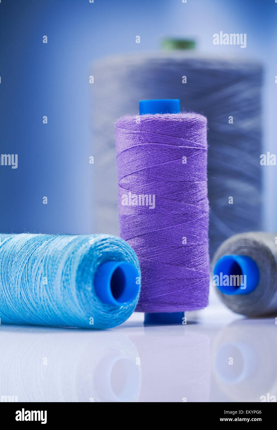 Blue sewing thread on spool hi-res stock photography and images - Alamy