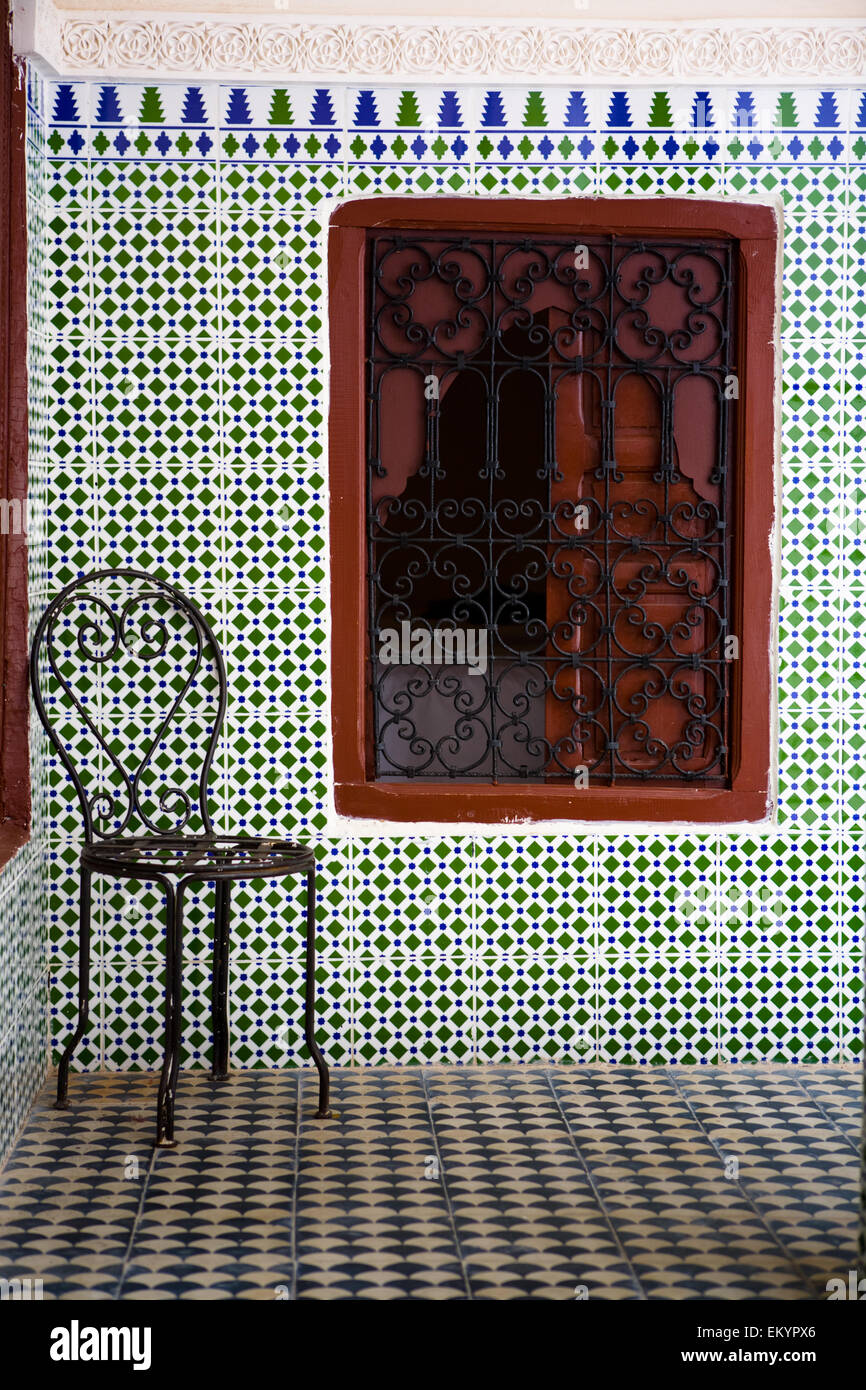 Riad corner with a n iron chair and window, Marrakesh, Morocco Stock ...