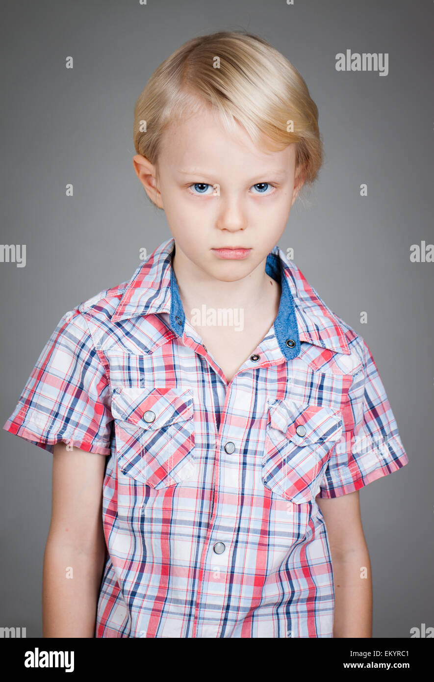 Sad grumpy young boy Stock Photo - Alamy