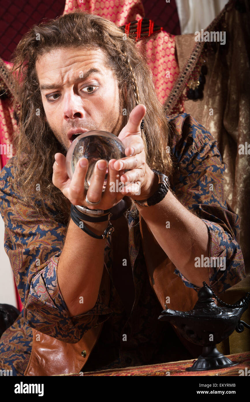 Gypsy Man with Crystal Ball Stock Photo - Alamy