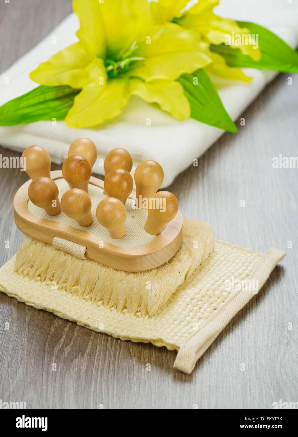 flower on towel and massager on bast Stock Photo - Alamy
