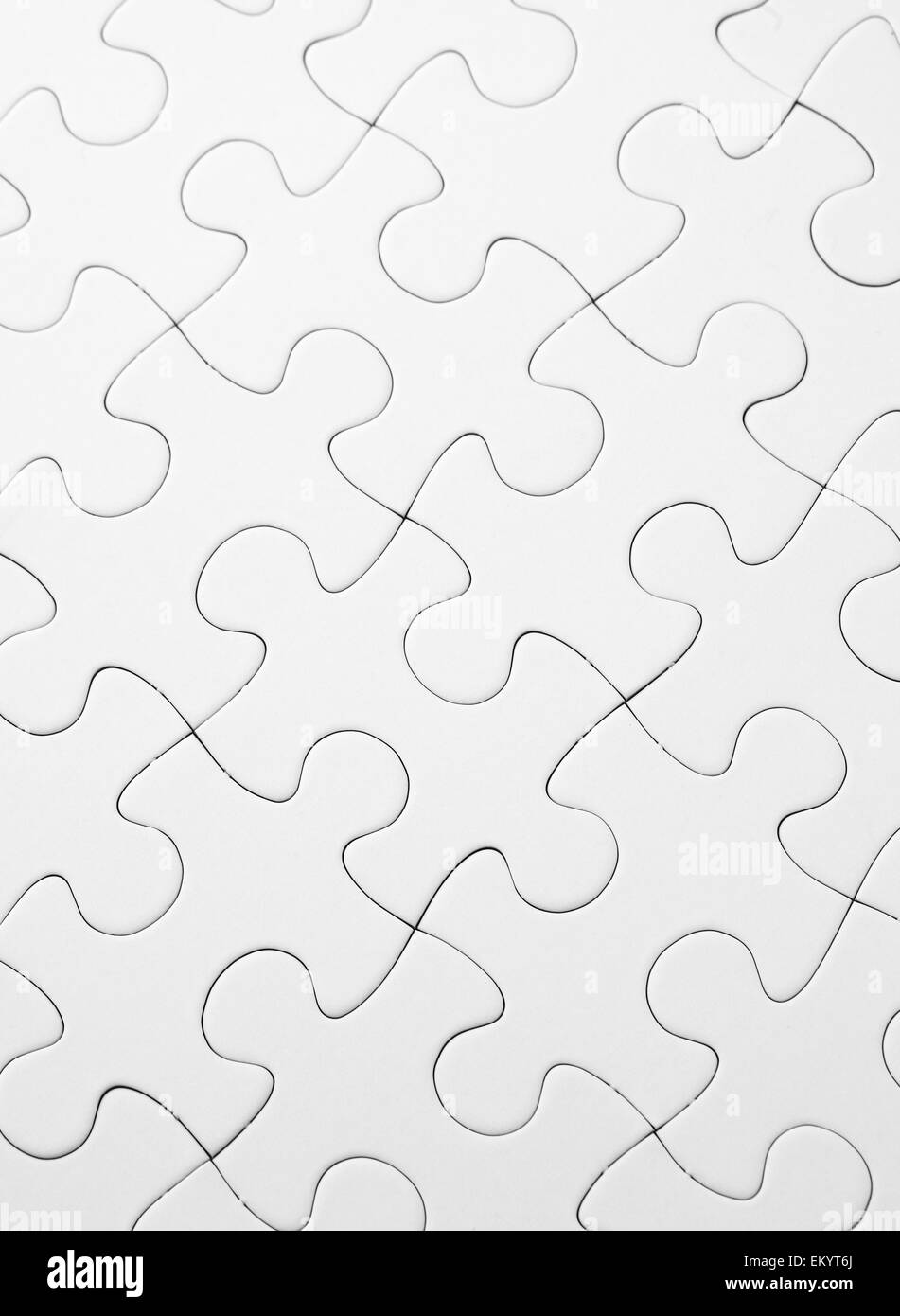 Part of completed white puzzle Stock Photo - Alamy