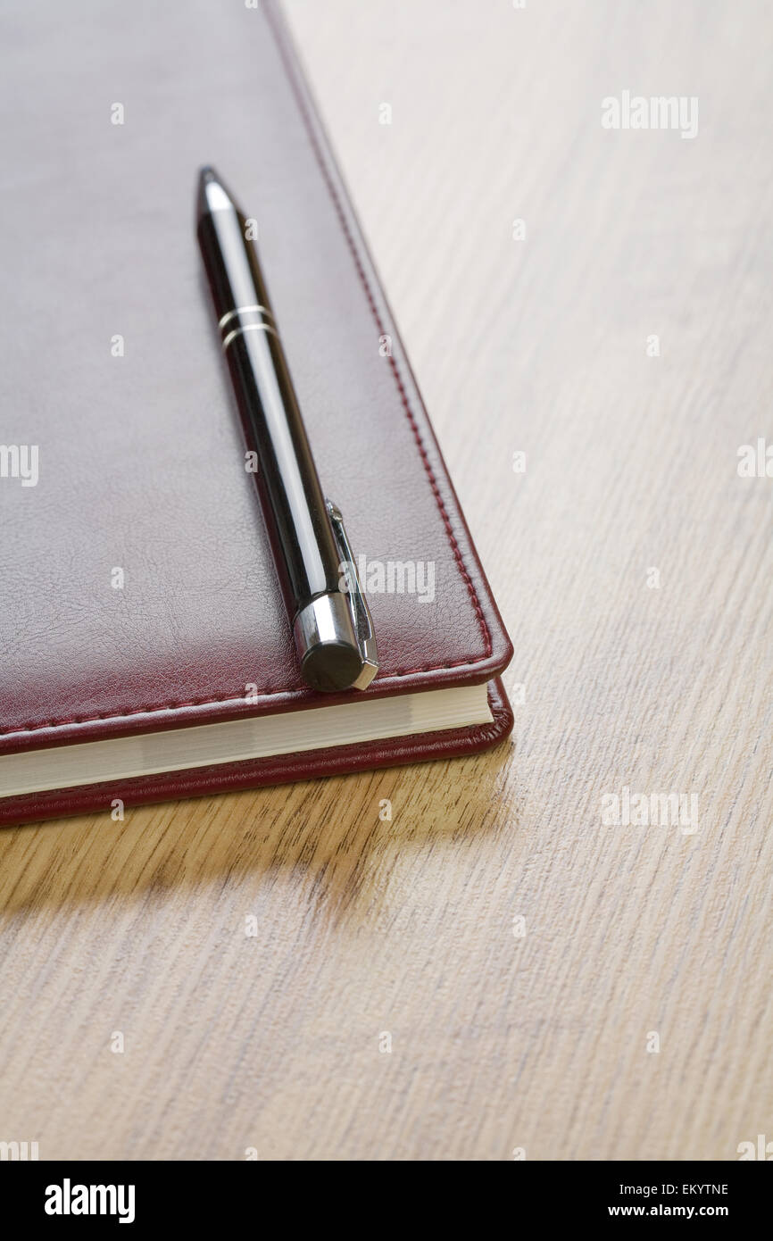 notebook with pen Stock Photo - Alamy
