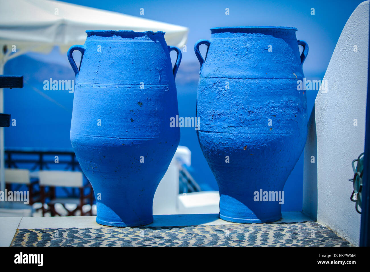 Traditional two large blue bins in the Greek village Stock Photo - Alamy