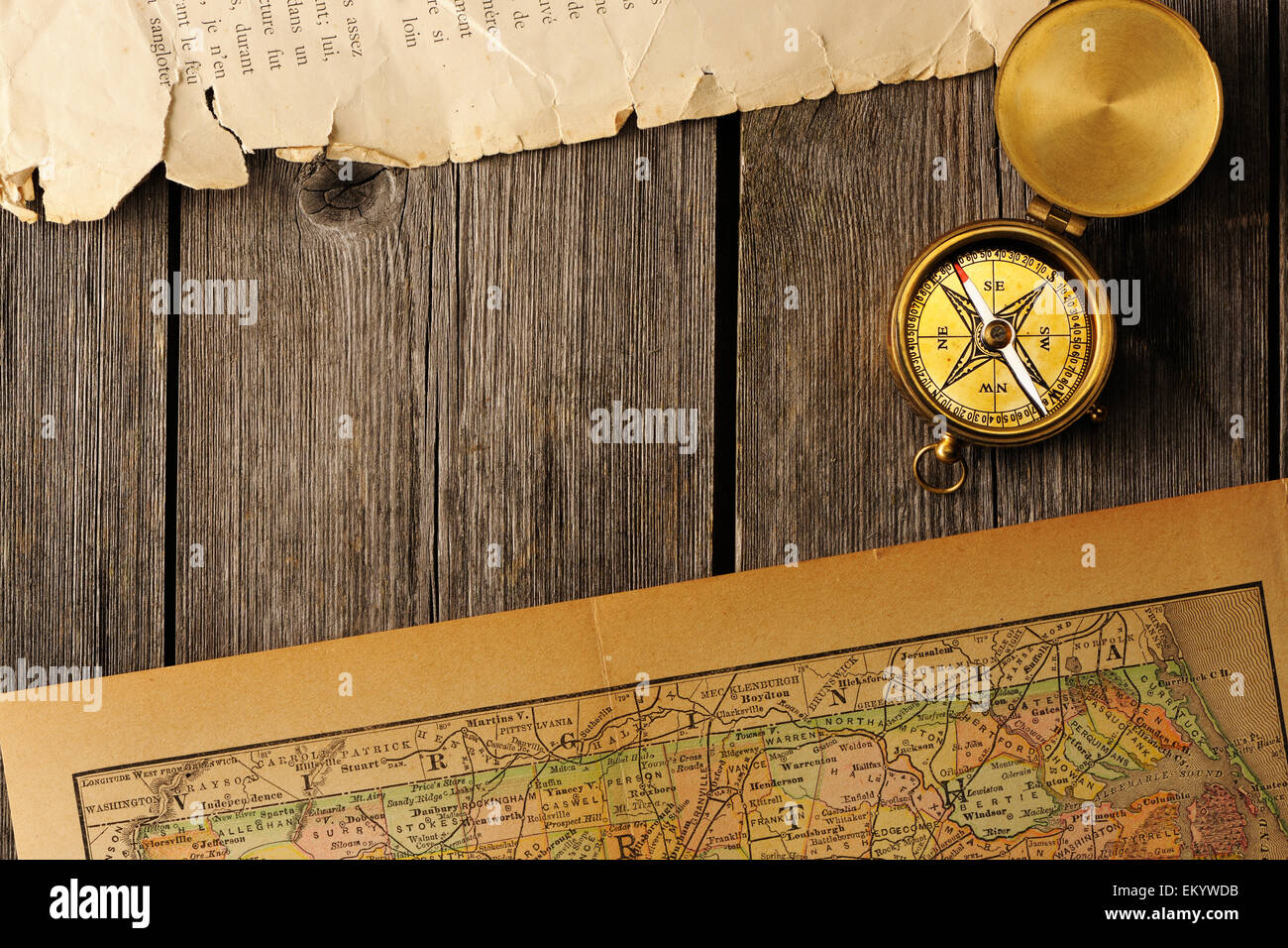 Antique compass over old map Stock Photo - Alamy