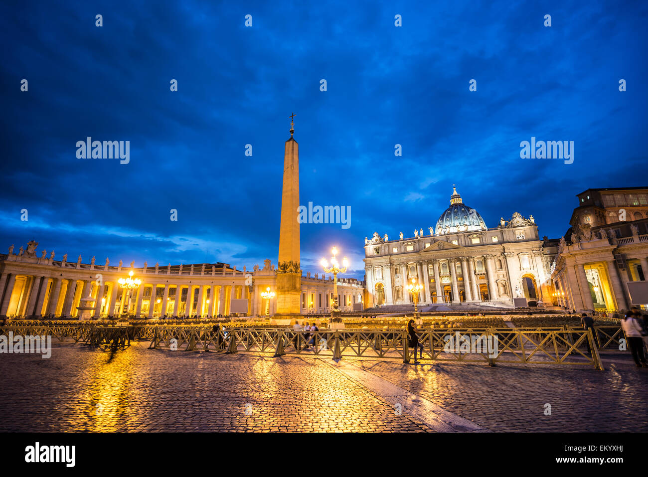 St. Peter's Square with St. Peter's Basilica and obelisk, clouds, dusk ...