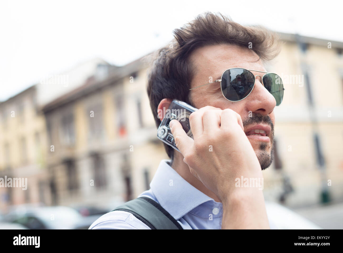 man in the street on the phone Stock Photo - Alamy